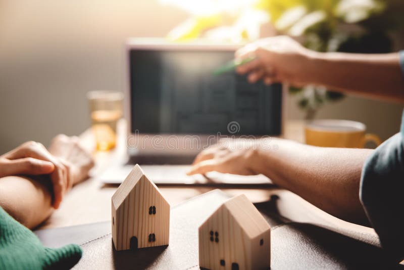 Buying a New House Concept. Real Estate Agent Explaining a Plan Design ...