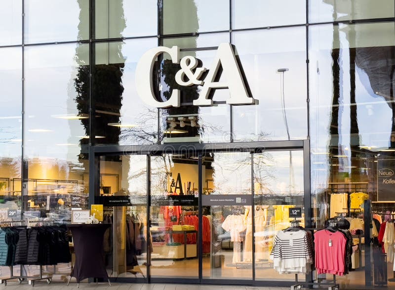 C a Clothing Storefront Exterior with Reflections on Glass Display ...