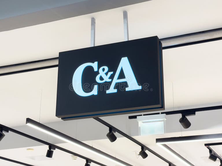 C a Store Signage with Modern Ceiling Lighting in Retail Environment ...