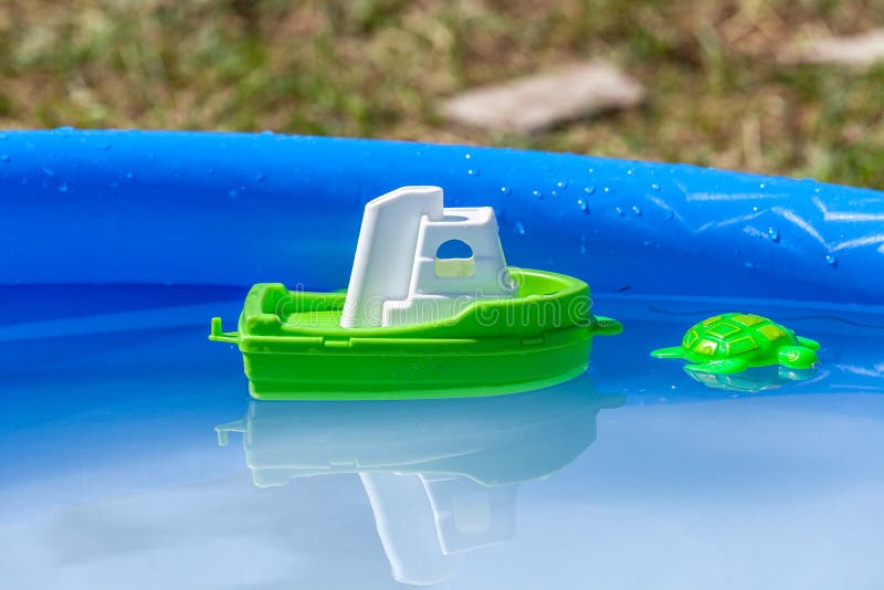 Toy Plastic Boat and Turtle in a Pool Stock Photo - Image of bathtub ...