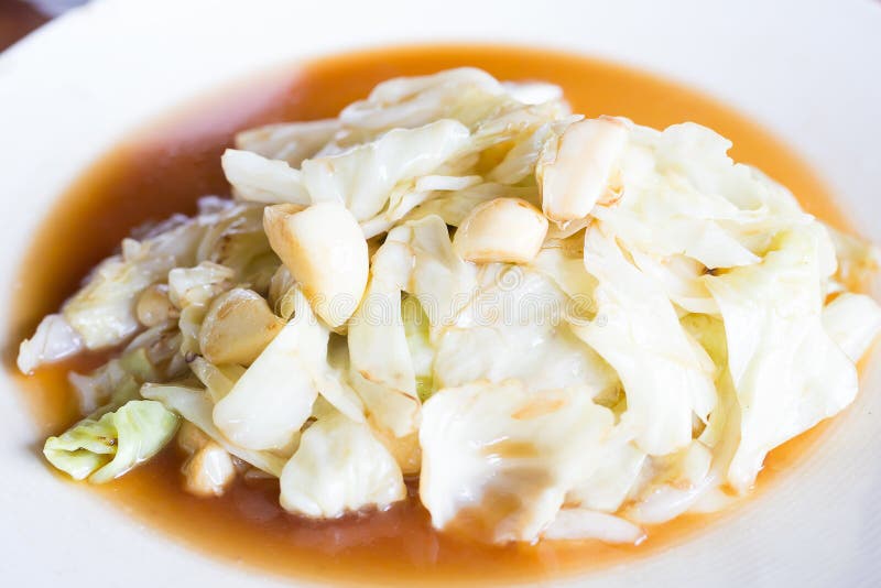 Cabbage Fried with Fish Sauce and Garlic Stock Photo - Image of cooked ...