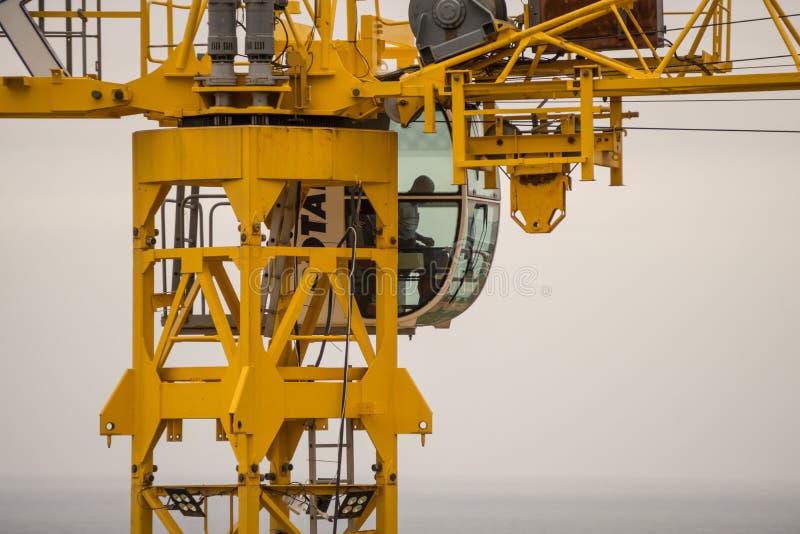 Cabin of Construction Tower Crane with Operator High Over the Ocean ...