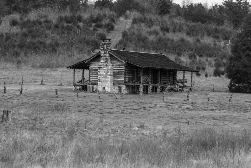 Old log cabin in field stock photo. Image of cement - 130043028