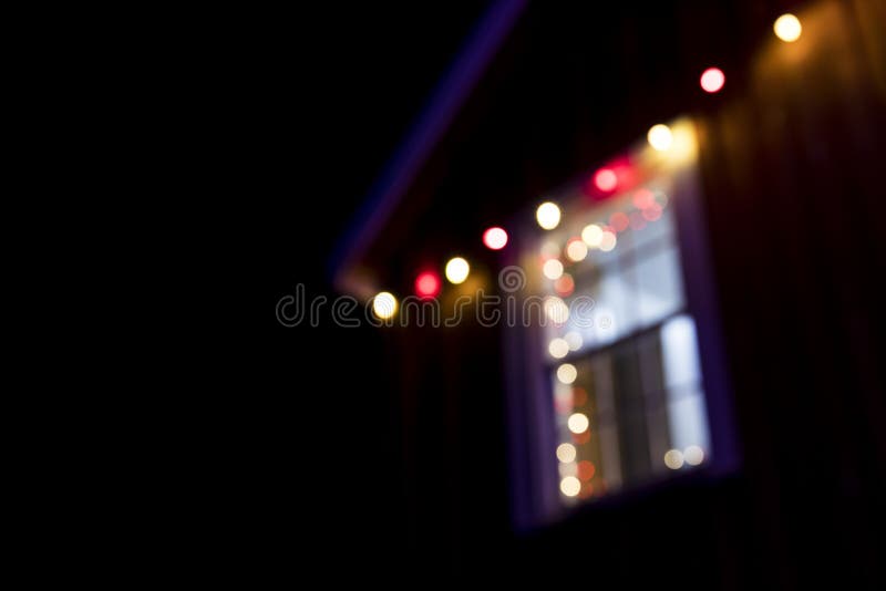 Cabin Window Lit Up with Red and White Holiday Lights in the Dark Stock ...