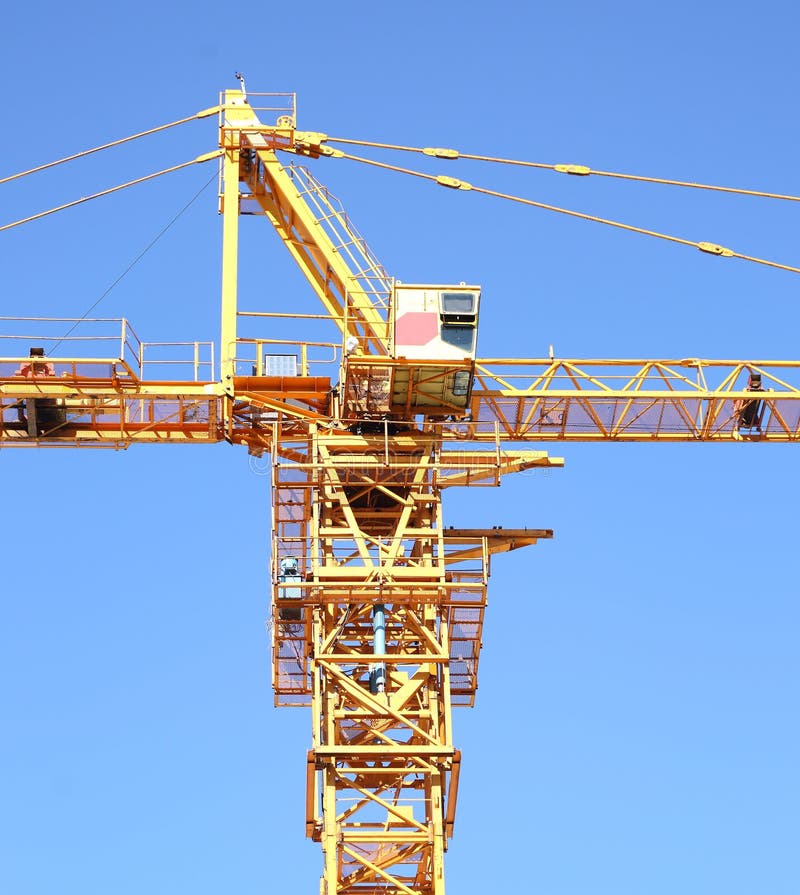 Cabin of a Yellow Tower Crane is High in the Blue Sky Stock Image ... Cabin of a Yellow Tower Crane is High in the Blue Sky Stock Image ...