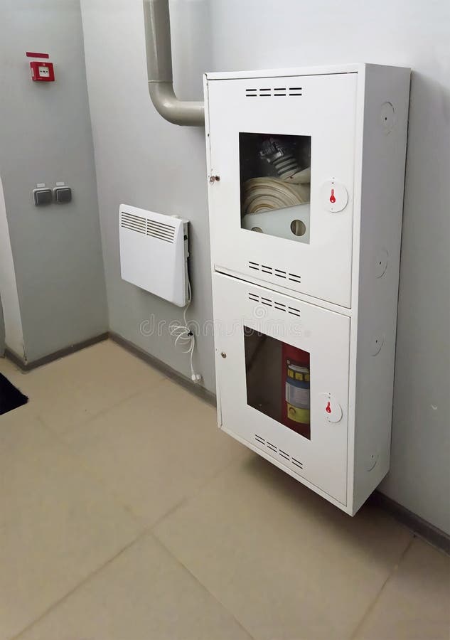 Cabinet with fire hose stock image. Image of extinguish - 154461689