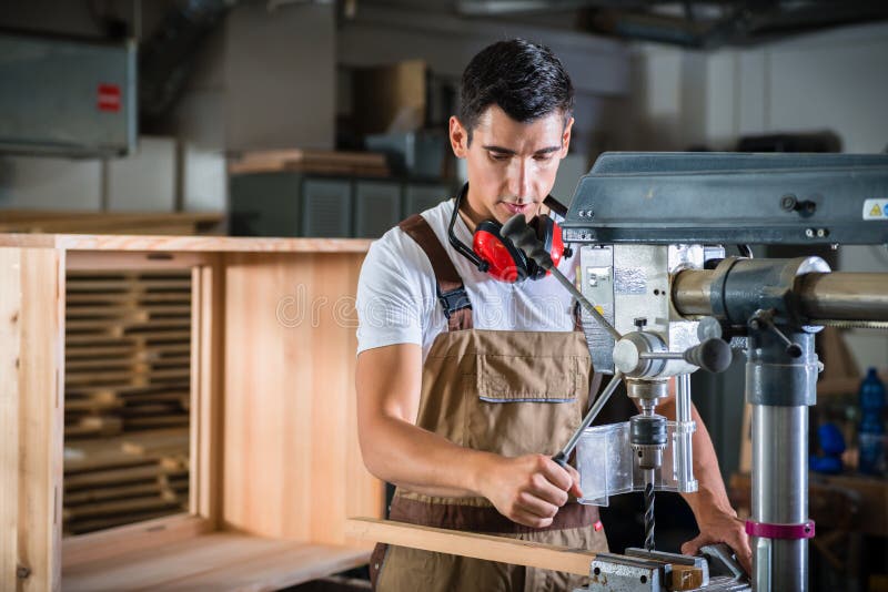 Cabinet Maker Working on Power Drill Stock Photo - Image of workshop ...