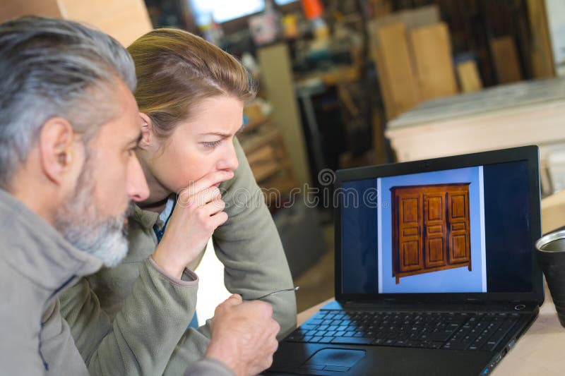 Cabinet Manufacturers Looking at Design Stock Photo - Image of ...