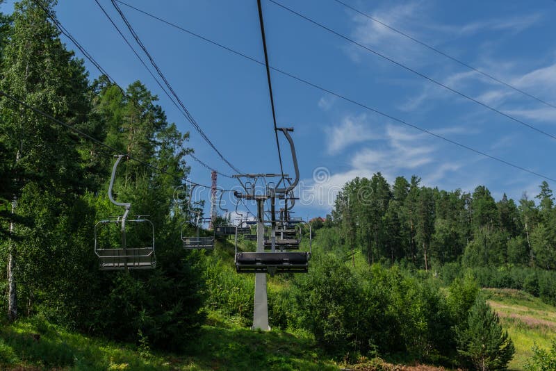 Cable Car Construction with Wires and Empty Seats among Green Trees ...