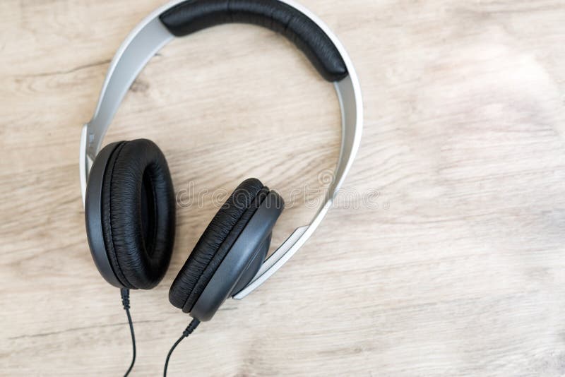 Modern Headphones on Wooden Table Stock Photo - Image of earphone ...
