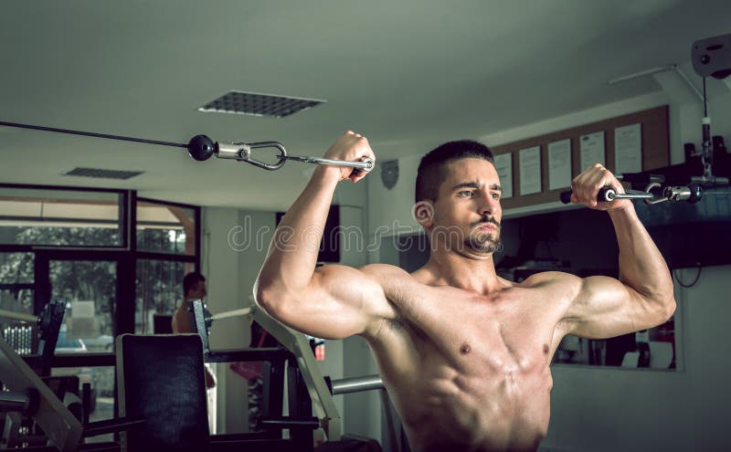 Cable fly exercise stock image. Image of cable, bodybuilder - 57083593