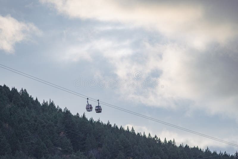 Cable Car Gondola at Ski Resort with Snowy Mountains on Background ...