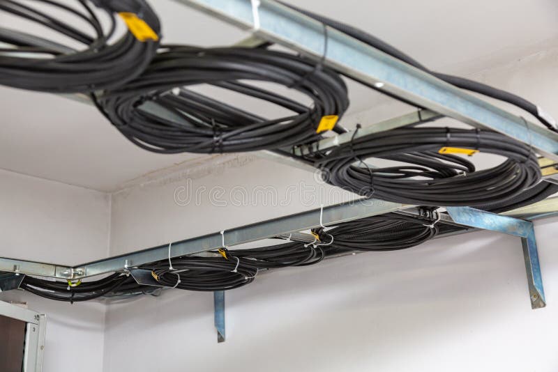 Cable Management. Working Wires, Black Cables Wound into a Coil, a ...