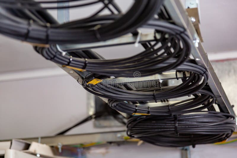 Cable Management. Working Wires, Black Cables Wound into a Coil, a ...