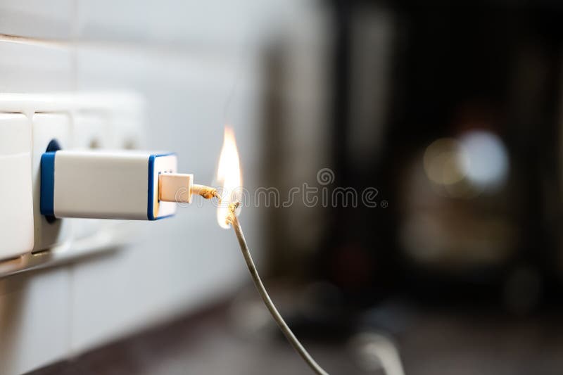 The Cable Plugged into the Socket Caught Fire. Danger of Using a Broken ...