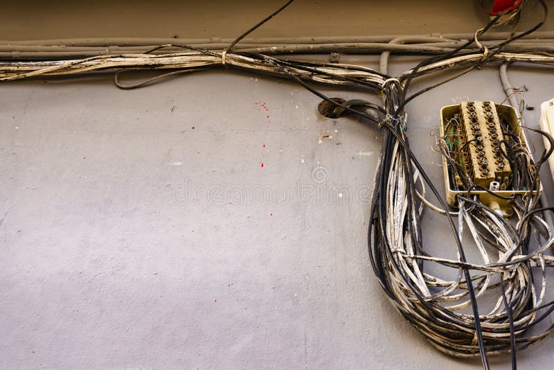 Cable Power Cords in Tangled Mess on Wall Outdoor Stock Photo - Image ...
