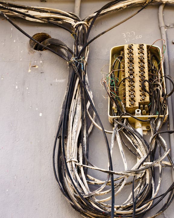 Cable Power Cords in Tangled Mess on Wall Outdoor Stock Image - Image ...