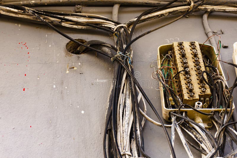 Cable Power Cords in Tangled Mess on Wall Outdoor Stock Image - Image ...