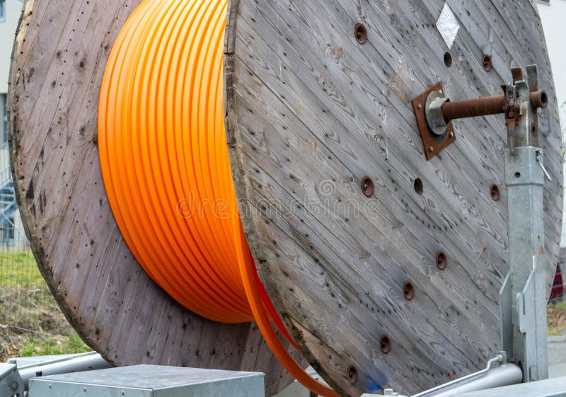 Cable Reel on a Construction Site with an Orange Cable Stock Photo ...