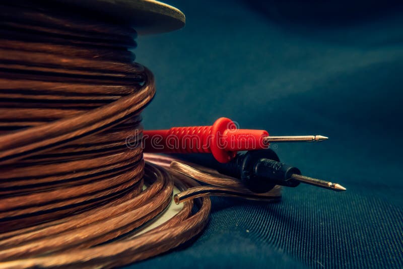 Cable Roll Isolated on Dramatic Background with Volt Meter Tester Stock ...