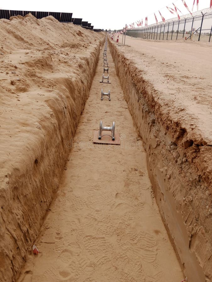 Cable Rollers or Guide Wheels Placed in Trench for Cable Pulling. Stock ...