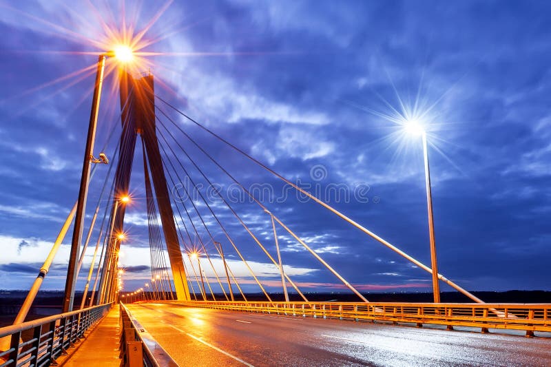 Cable-stayed Bridge at Sunset Against a Beautiful Sky and in the Rays ...