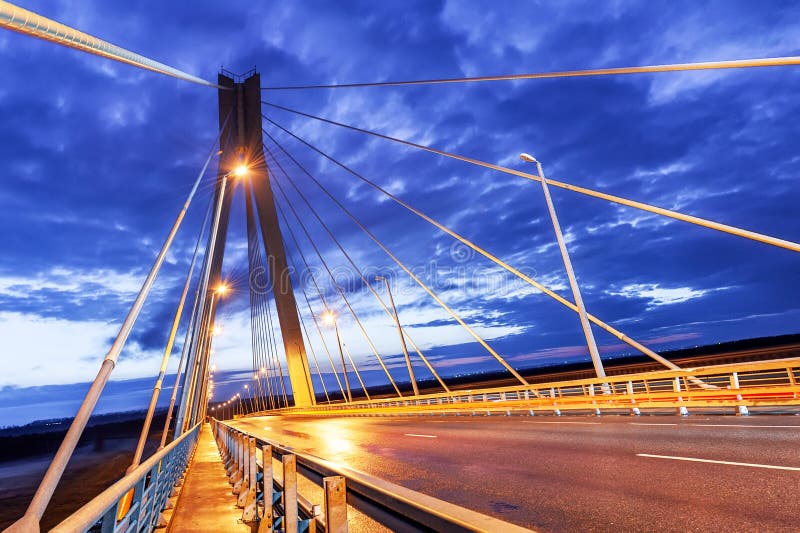 Cable-stayed Bridge at Sunset Against a Beautiful Sky and in the Rays ...