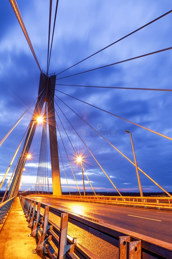 Cable-stayed Bridge at Sunset Against a Beautiful Sky and in the Rays ...