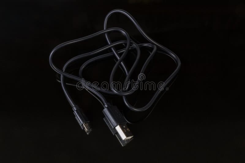 Cable USB To Micro-USB on a Dark Reflective Surface Stock Image - Image ...