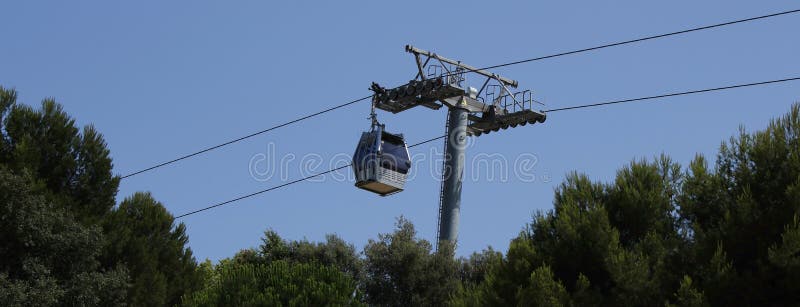 Cable way cabin over trees editorial image. Image of spain - 90045280