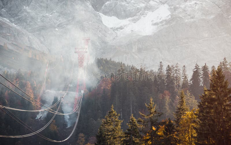 Cables of Alpine Ropeway Going through Forest Covered in Smoke Stock ...