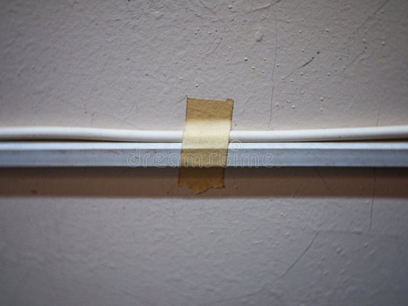 The Cables are Attached To the Wall with Paper Tape To Make it Look ...