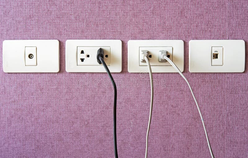 Cables Plugged in a White Electric Outlet Mounted on Pink Wall Stock ...