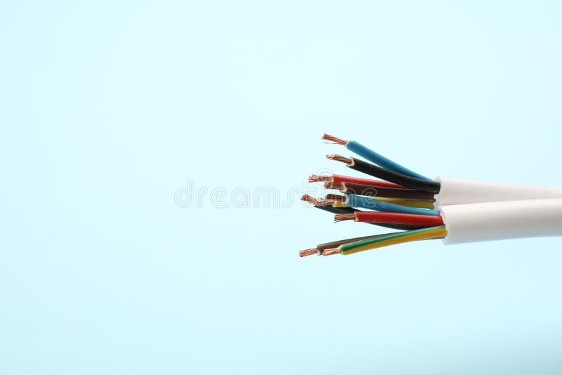 Cables with Stripped Wires on Light Blue Background, Closeup Stock ...