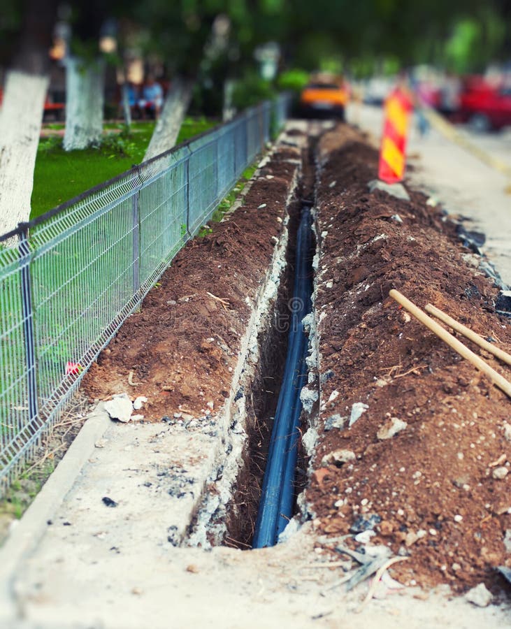 Cables in trench stock image. Image of daylight, alley - 32308875