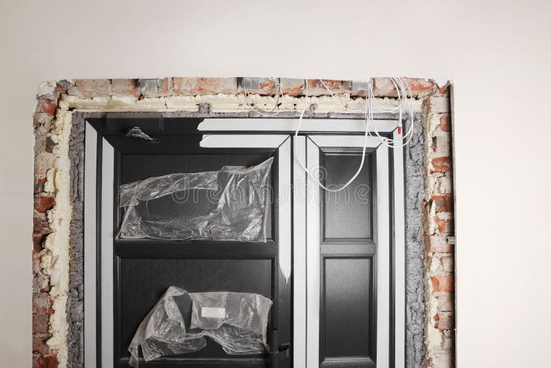 Cables in Wall Near Doors Indoors. Installation of Electrical Wiring ...