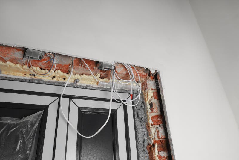 Cables in Wall Near Doors Indoors. Installation of Electrical Wiring ...