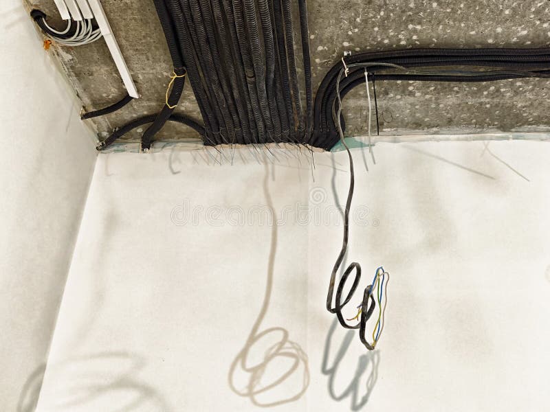 Exposed Wiring and Cables Hanging from a Ceiling in a Modern ...