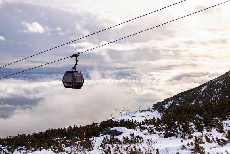 Cableway Cabin Above the Clouds at Sunset Stock Photo - Image of ...