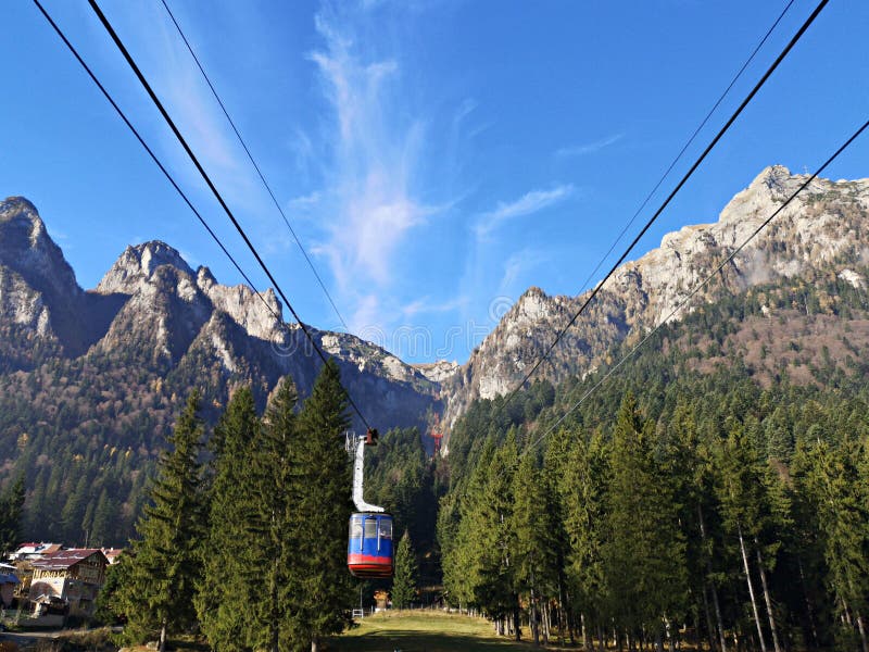 Cableway in the Mountains. Cable Car Passing through Forest during Fall ...
