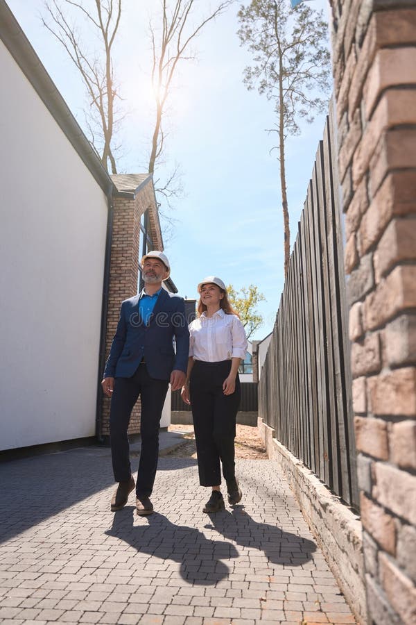 Cadastral Service Workers in Hardhats Walking Along Construction Site ...