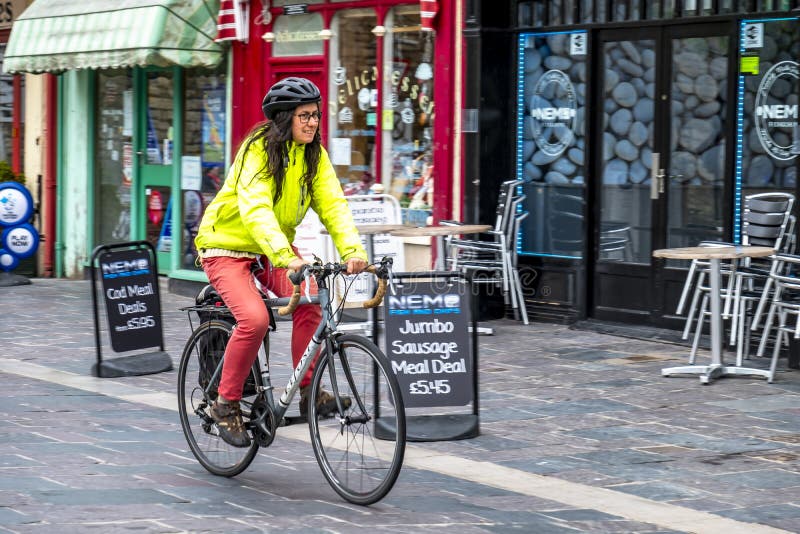 Caernarfon , Wales - May 01 2018 : Lady with Bicycle Driving through ...