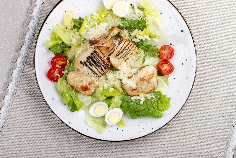 Caesar Salad with Chicken on a White Decorative Plate. a Classic Salad ...