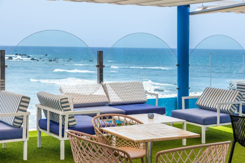 Cafe with Blue and White Tables and Chairs with a Great View of the Sea ...