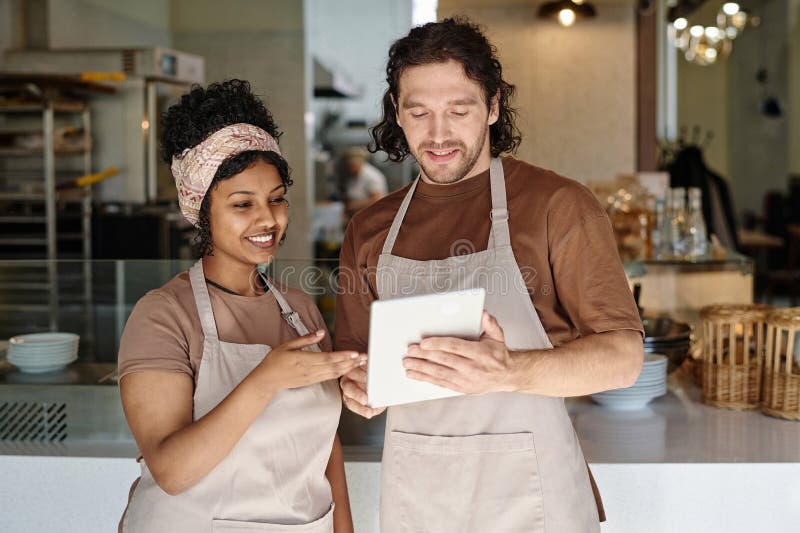 Cafe Employees Having Professional Conversation at Workplace Stock ...