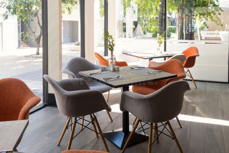 Cafe Interior Design with Table, Chairs Near Big Windows Stock Photo ...