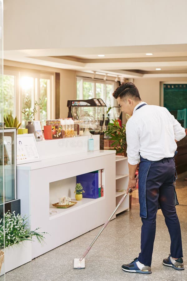 Cafe owner cleaning floor stock photo. Image of covid19 - 184021628