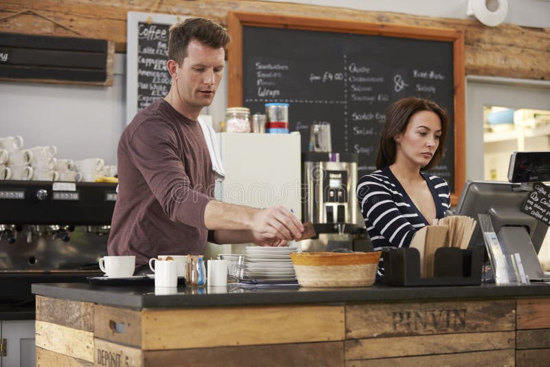 Cafe Owners Working Behind the Counter of Their Coffee Shop Stock Photo ...