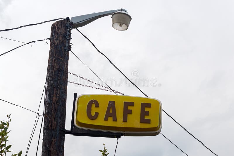 Cafe Sign Chained To a Light Pole Stock Image - Image of light ...