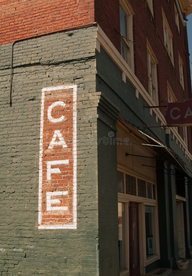 Cafe Sign on Historic Brick Building Stock Photo - Image of ...